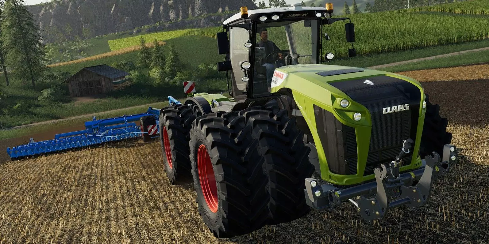 Mann um Traktor am Feld schafft