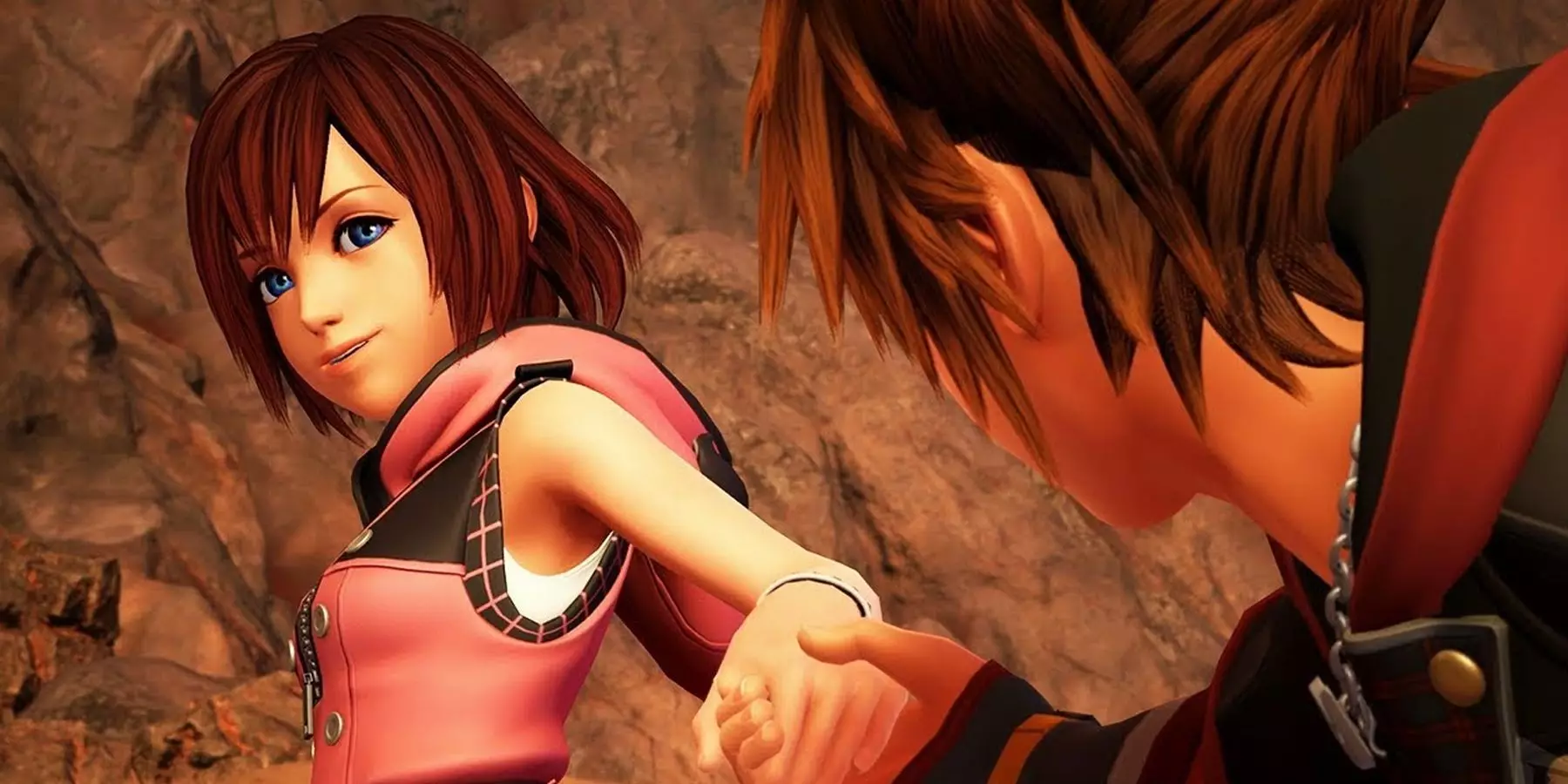 Kairi drži Soru za ruku u Kingdom Hearts 3.