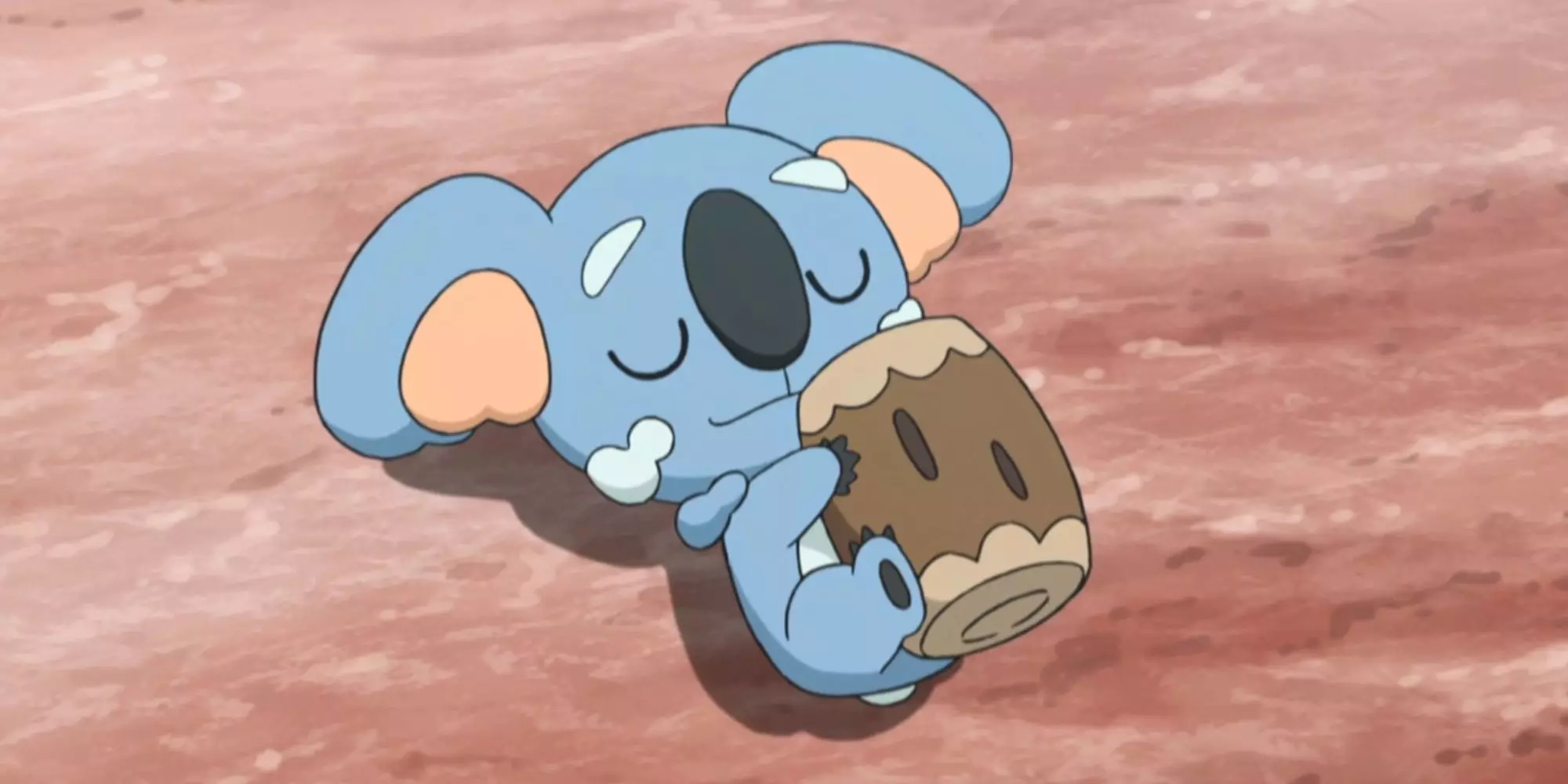 ’n Komala wat in die anime op die grond slaap